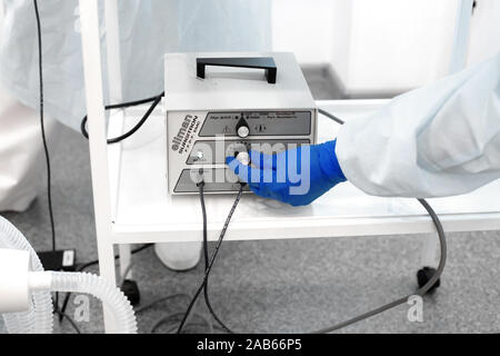 setting up the device for burning moles surgical procedure for removing ...