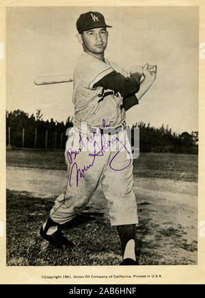 Baseball player, catcher in a black white sports uniform practicing ...