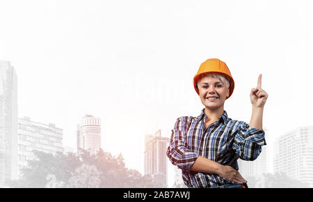 Beautiful female builder in hardhat Stock Photo - Alamy