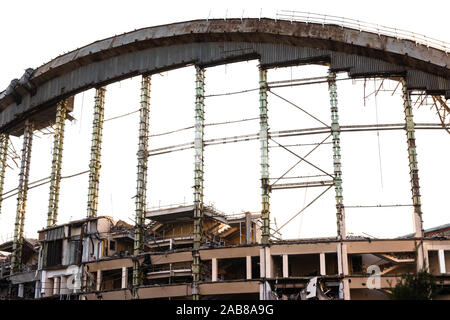 Demolition of the arena. Old metal frame of the building, destroyed ...
