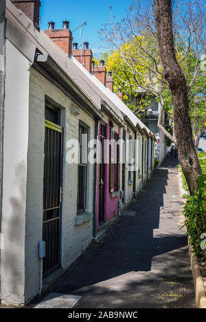 Modest historical houses in a row in the city center of Bruges, West ...