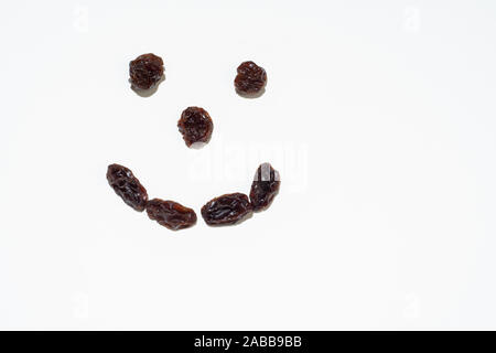 Raisins happy face isolated on white background, close up Stock Photo ...