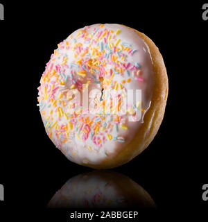 Glazed donut with reflection and clipping path on a black background ...
