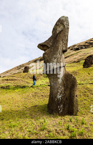 Moai Ko Kona He Roa (on the right) statue features a carving of a European ship on its front at ...