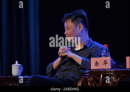 --FILE--Chinese writer Yu Hua talks with college students in Hangzhou ...