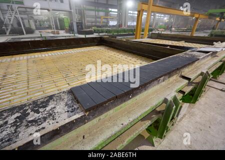Workers production templates formwork for cement pouring of concrete ...