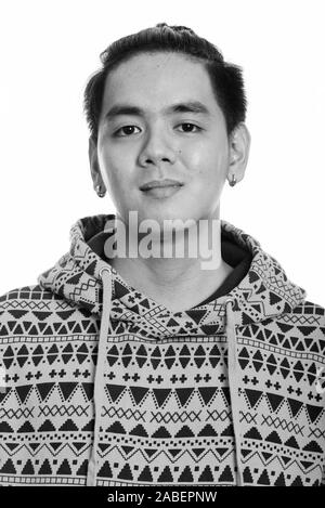 Back shot of a young man black outfit running beside the beach at ...