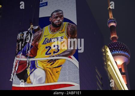 Construction workers dismentle a giant poster of NBA before 2019 NBA ...