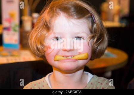 child mouth eating potato chips Stock Photo - Alamy