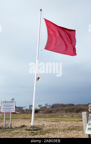 Red warning flags indicating live firing on the army ranges at Hythe ...