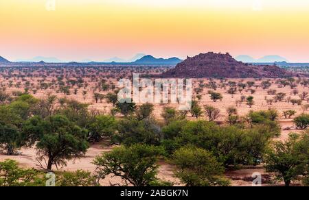 NAMIBIA Namib Desert Desert mountains and plains with pink and purple ...