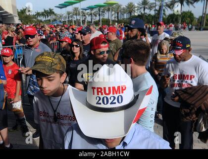People wait to hear President Donald Trump speak at Verst Logistics ...