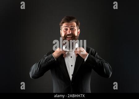 Classic and fashionable. Happy groom fix fashionable bow tie. Bearded ...