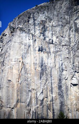 The rock formation known as "El Capitan" is shrouded in fog, located in ...