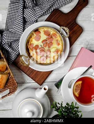 Top view of fried eggs with sausage, bread and vegetable Stock Photo ...