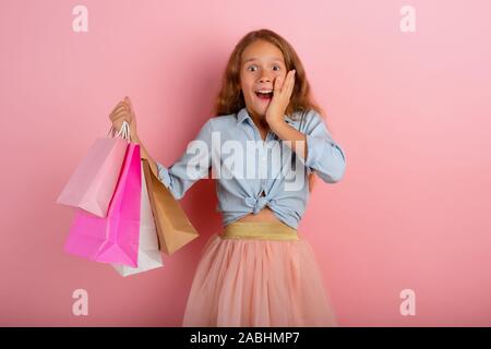 Happy child are amazed about a shop sales. surprised and emotional ...