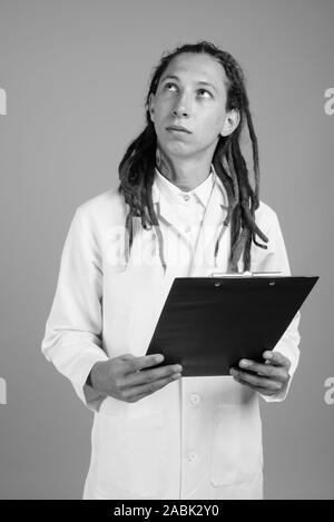 Thinking, clipboard and man doctor in hospital with medical chart for ...