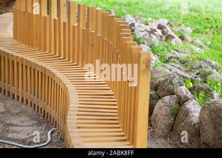 Large curved wooden garden bench seat, Coton Manor Gardens ...