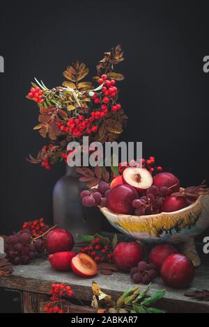 Fresh plums on dark rustic background. Organic fruits concept Stock ...