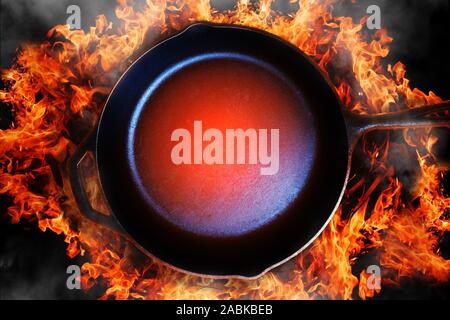 red frying pan with a smoke and fire Stock Photo: 55755756 - Alamy