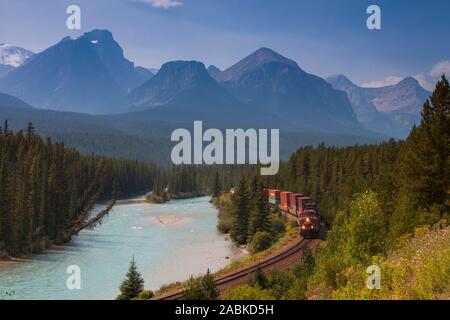 Canadian Pacific train at Morant's Curve in winter along the Bow River, Banff National Park ...