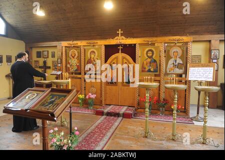 A Georgian Orthodox priest lights candles at the 6th century Georgian ...