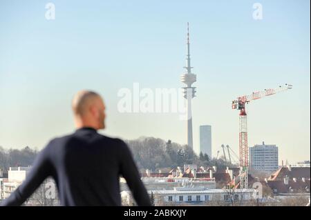 View over Munich to Olympiaturm and O2-Tower [automated translation ...