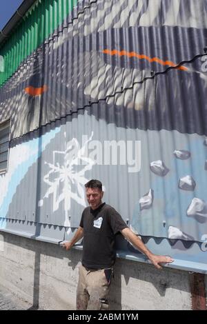 Graffiti artist Loomit (Mathias Köhler) in front of one of his ...