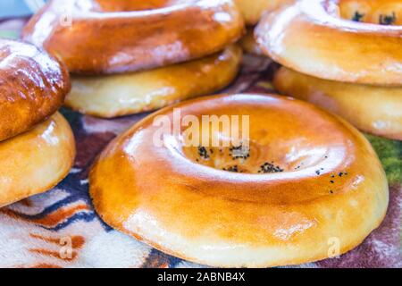 Tandir non or lepeshka, tarditional uzbek bread sold at Siab Bazaar in ...