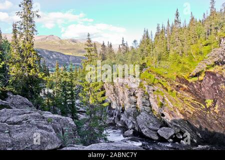 River of the beautiful waterfall Rjukandefossen with mountain and ...