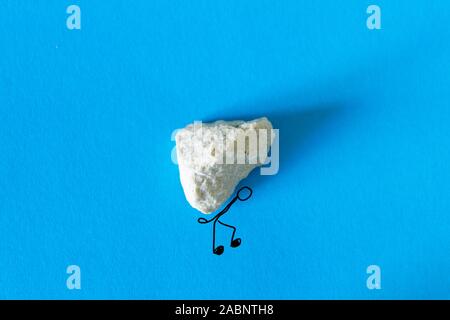 Drawing of a man carrying heavy stone Stock Photo - Alamy