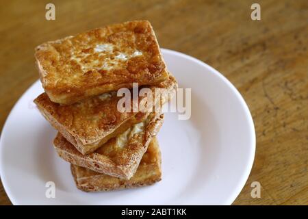 Photo of pile of freshly fried tofu or tokwa Stock Photo - Alamy