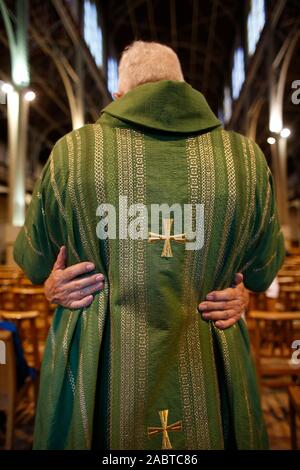 Catholic priest hugged by his parishioners after his last mass at Notre ...