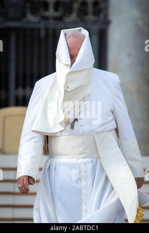 A gust of wind blows Pope Francis' mantle as he holds a special Jubilee ...