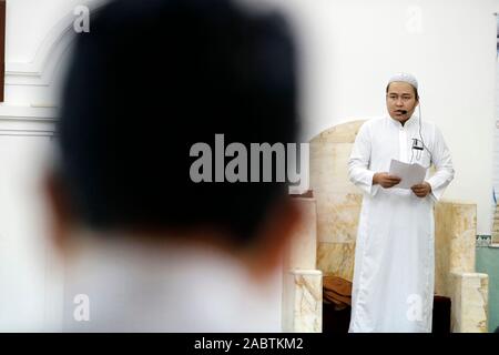 The friday prayer (jummah). Imam giving the sermon ( Khutbah). Masjid ...