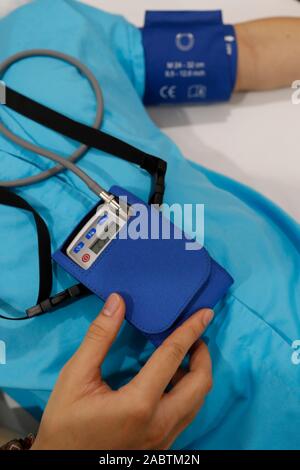 24-hour ECG monitoring and Holter monitoring on a woman body Stock ...