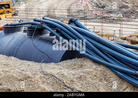 Drainage storage tank for flood water with pipes on construction site ...