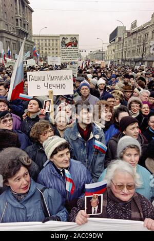 Citizens with the flags of Russia and the Soviet Union watch a festive ...