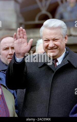 Russian President Boris Yeltsin standing on a rostrum with a flag in ...