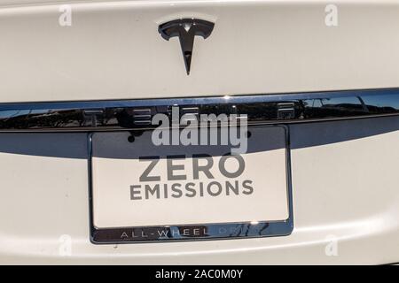 Tesla electric car with ZERO EMISSIONS text on the license plate ...