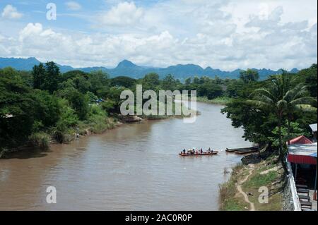 A boat on the Moei River, a natural border between Mae Sot, Thailand ...