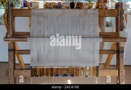 Old traditional wooden weaving loom on old traditional Romanian house ...