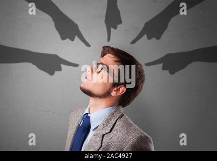 Young innocent student with pointing hands concept Stock Photo - Alamy