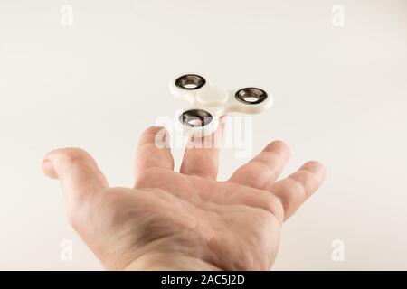 bearing spinner is a great stress reliever toy Stock Photo - Alamy