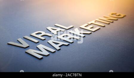 Word viral marketing written with white solid letters on a board. Word ...