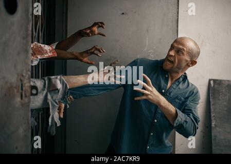 Man running away from zombie army, apocalypse Stock Photo - Alamy