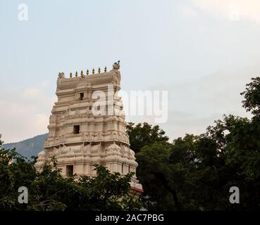 Temple tower along the mountain range of Talamalai Reserve Forest, Hasanur, Tamil Nadu ...