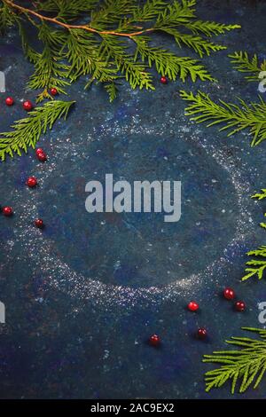 Round shape made from powdered icing sugar for baking on a blue table ...