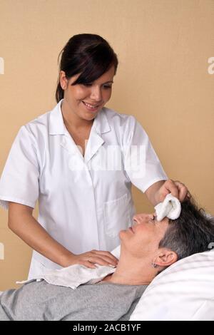 Nurse washes a patient Stock Photo - Alamy
