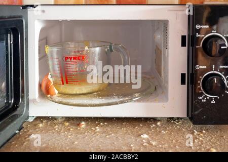 Food exploded in microwave oven / warning oven with cup food overflow ...